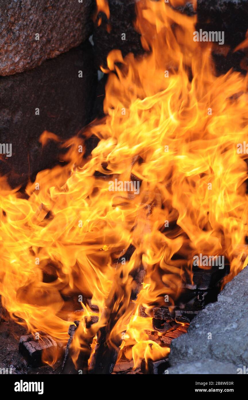 Campfire fire kindled in a camping trip Stock Photo - Alamy