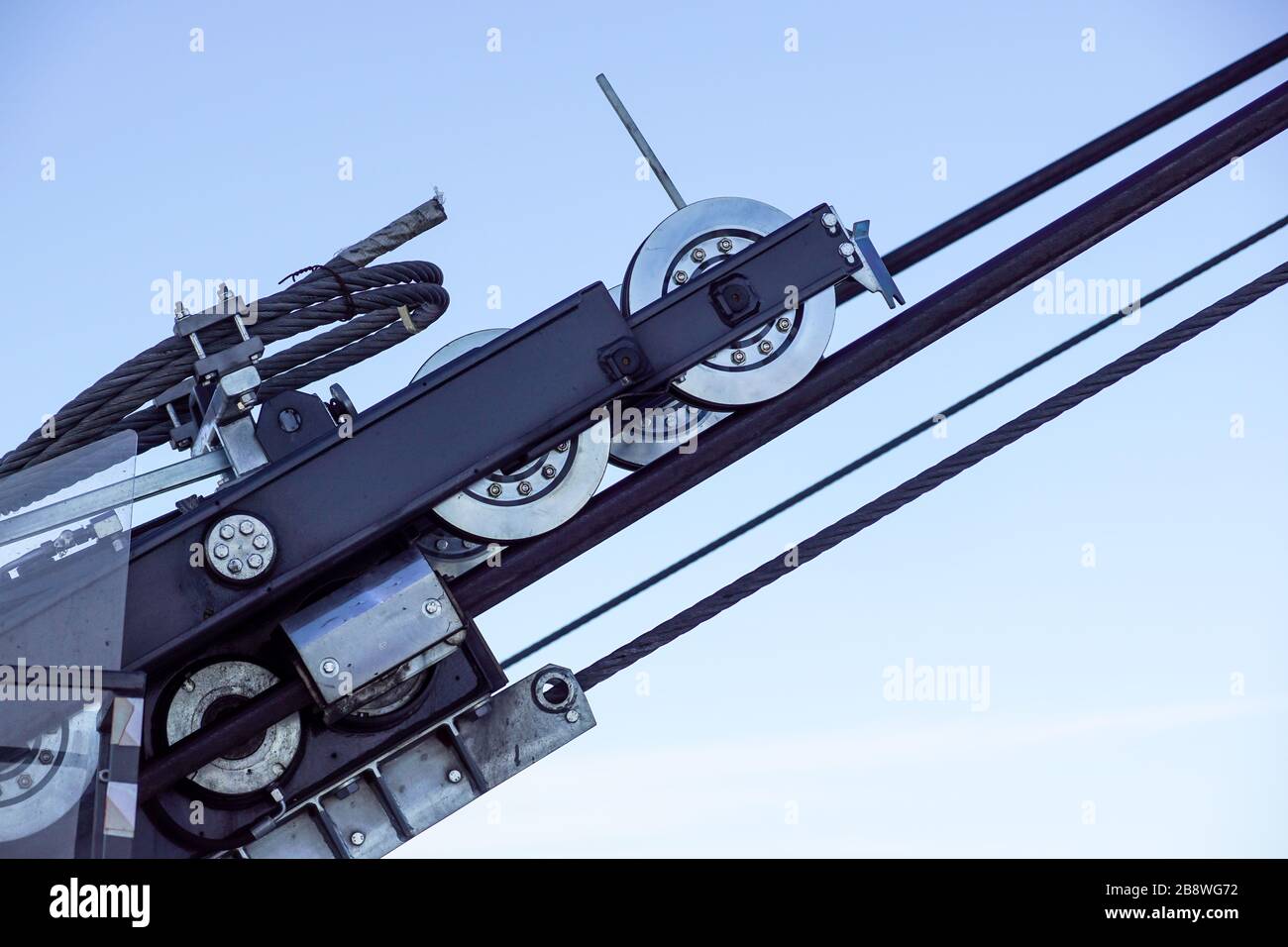 A mechanism that pulls a steel rope on a ski lift Stock Photo - Alamy