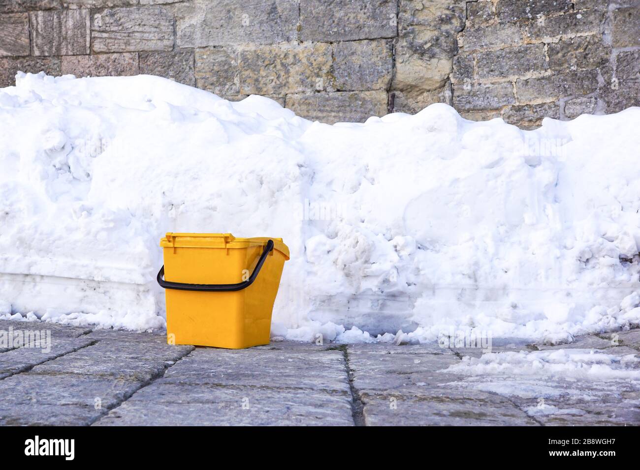 Plastic bucket used as a garbage dump beside the walkway Stock Photo ...