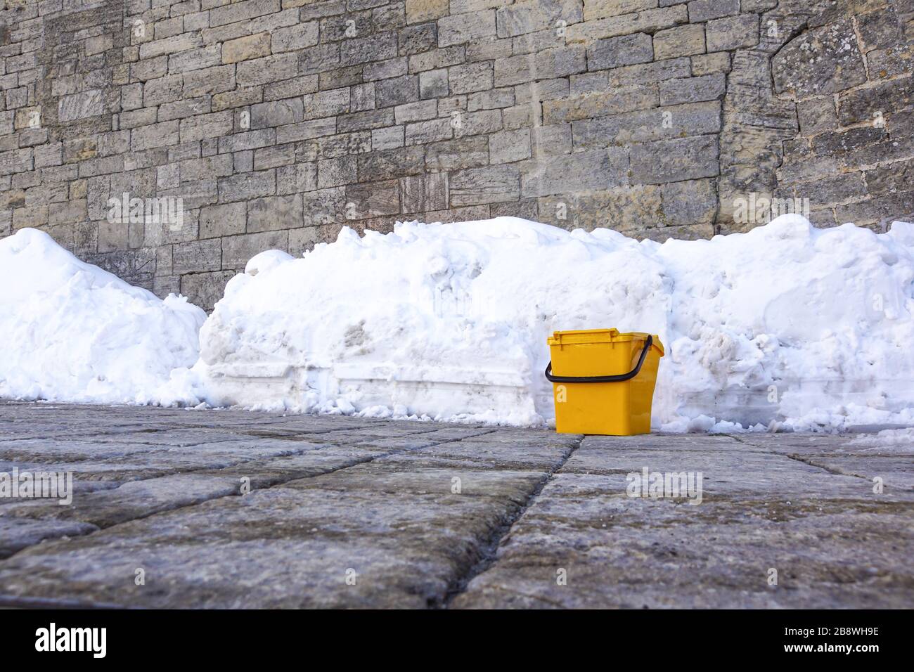 Plastic bucket used as a garbage dump beside the walkway Stock Photo ...
