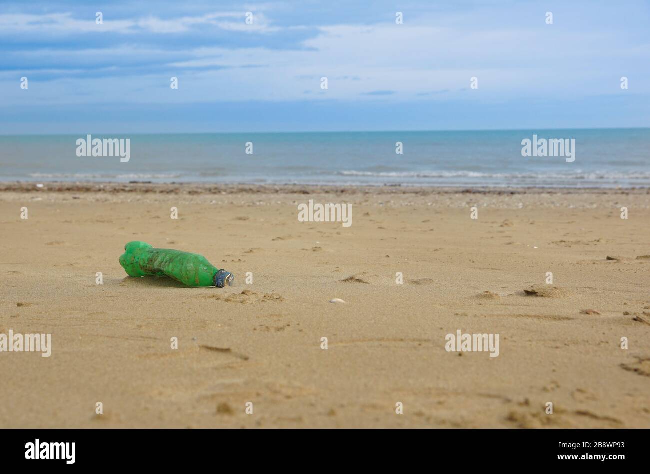 Waste plastic bottle on sand. Garbage on the beach Stock Photo - Alamy