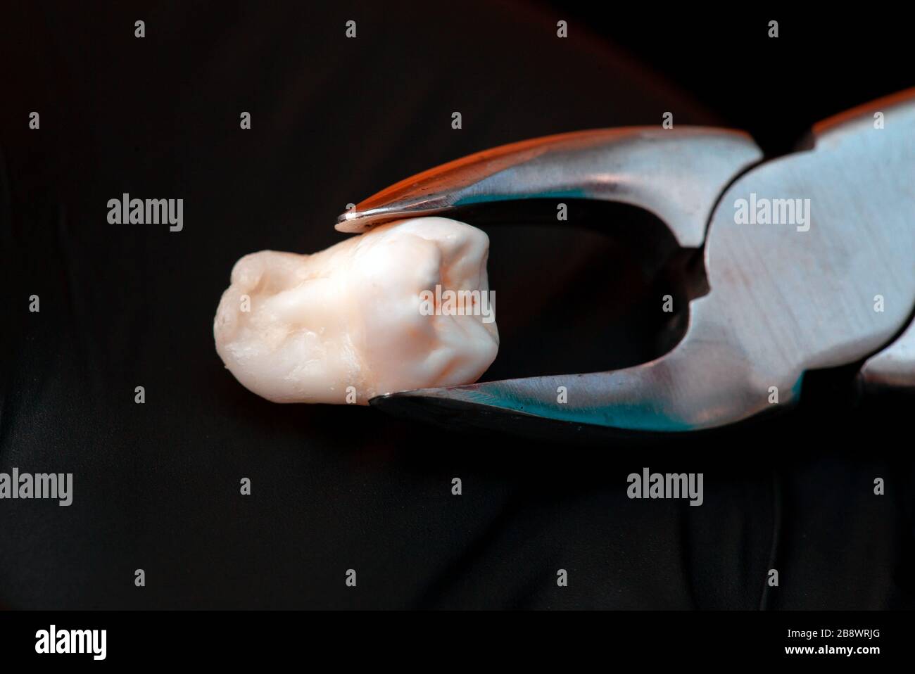 Dental tools and remove tooth at clinic isolated on black Stock Photo ...