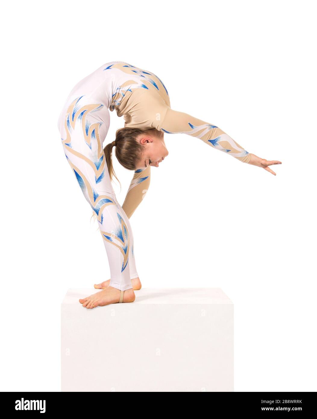 Acrobat doing gymnastics, a young circus artist in a white and blue ...