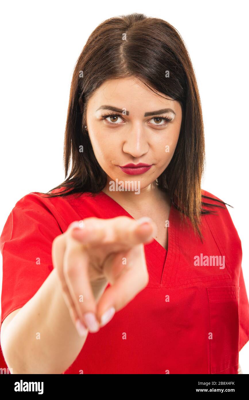 Portrait of doctor wearing scrubs making watching you gesture isolated ...