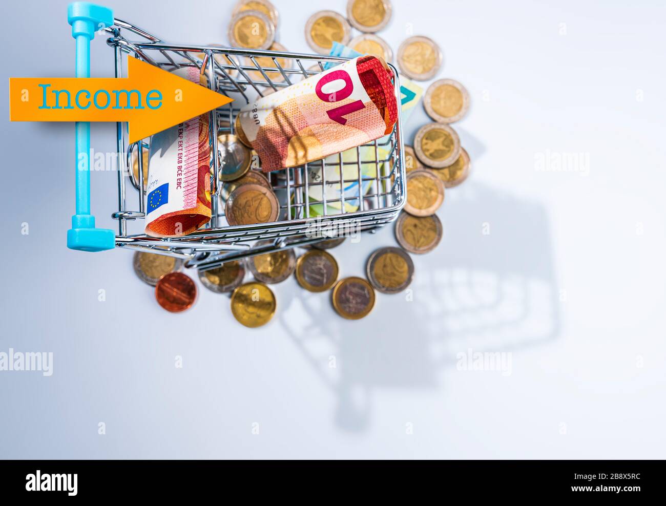 Text "Income" on arrow shape in shopping cart with money. Business ...