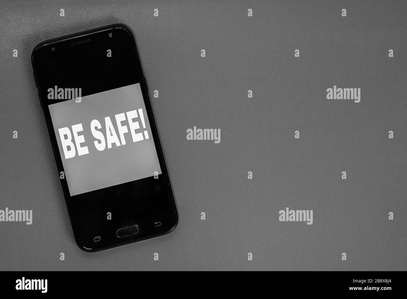 Be safe text on the screen of a smartphone. Medical protective ...
