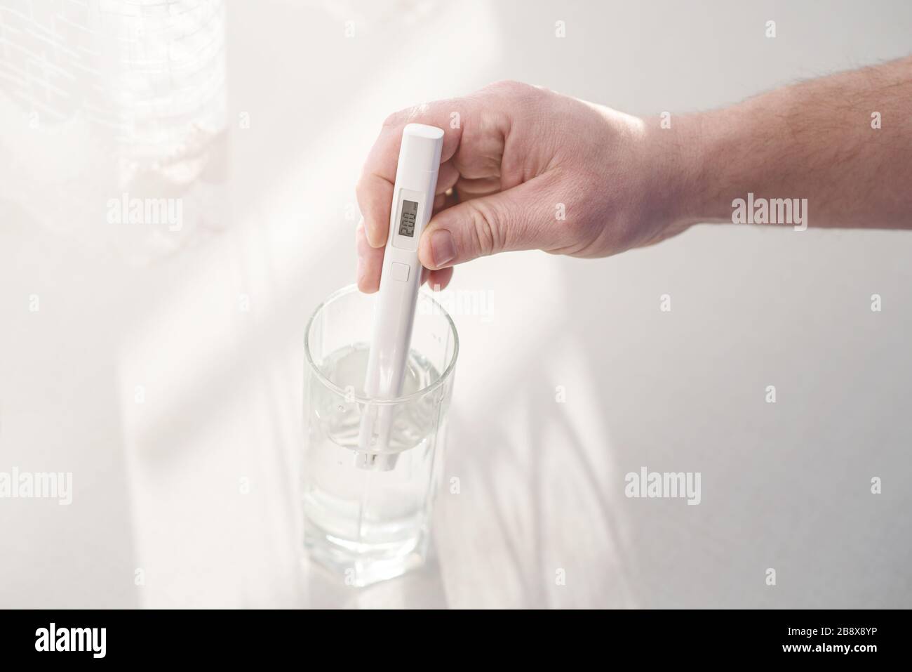 Man determines level of total dissolved solids or TDS in drinking water ...