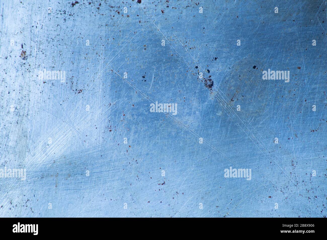 A surface of a worn-out metal baking tray, for gastronomical ...