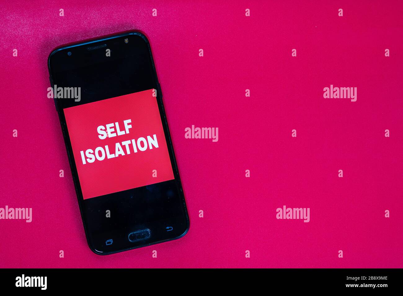 Self isolation text on the screen of a smartphone. Medical protective ...