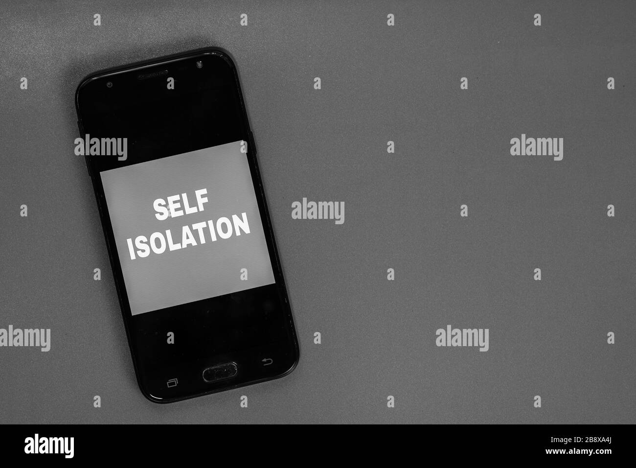 Self isolation text on the screen of a smartphone. Medical protective ...