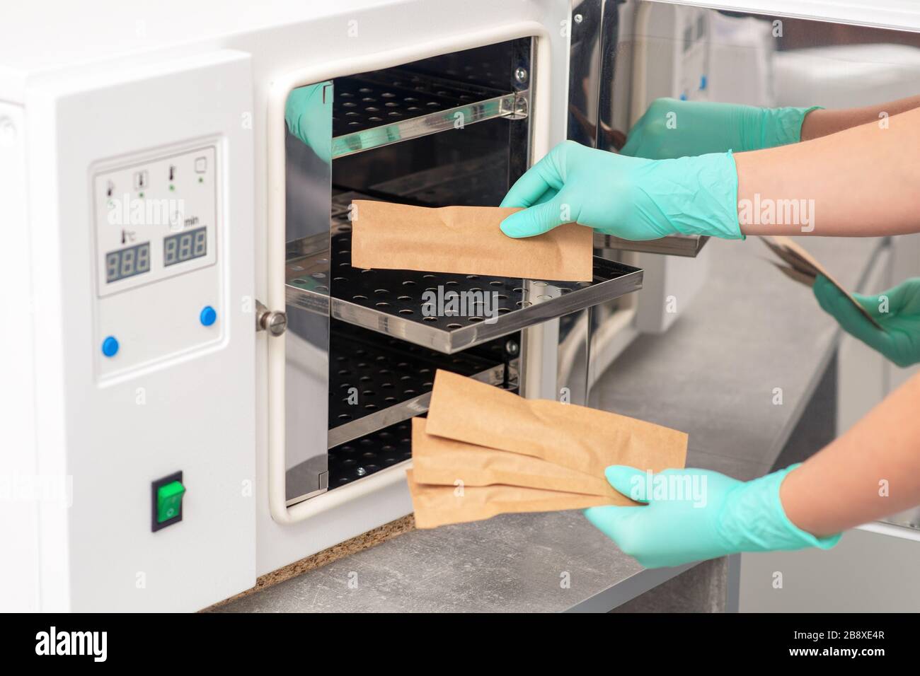 Hands cleans tools of medical instruments with cleaning systems ...