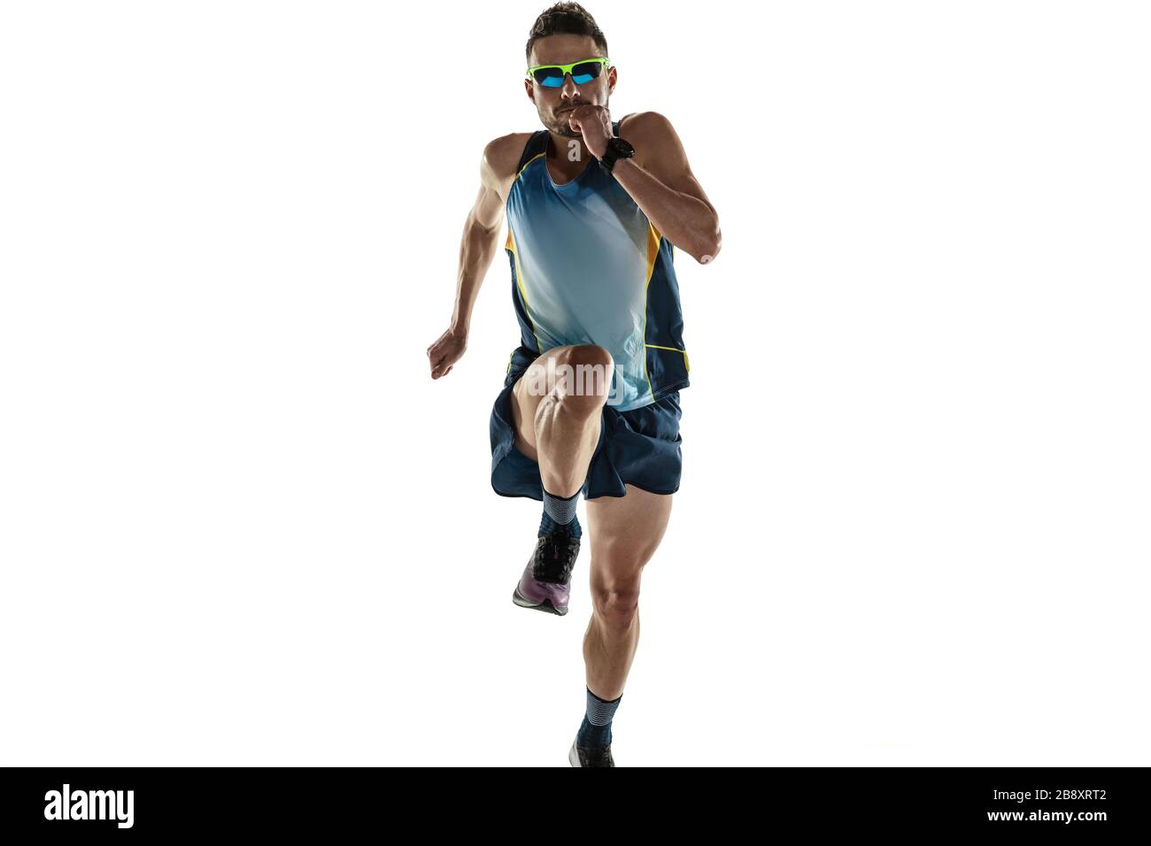 Triathlon male athlete running isolated on white studio background ...