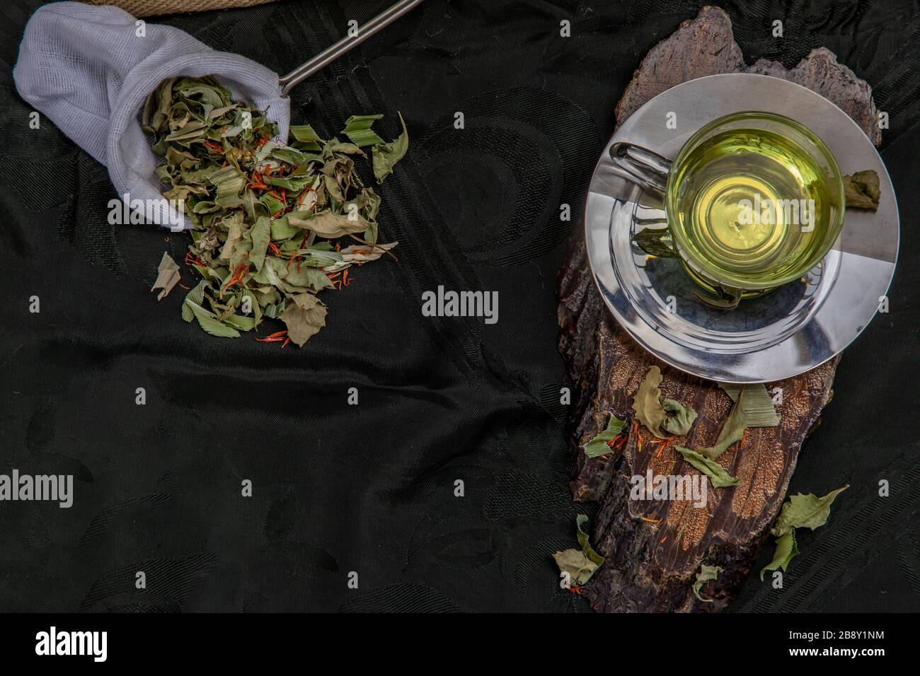 A Cup of pandan leaf tea, indian marsh fleabane plant leaves with ...
