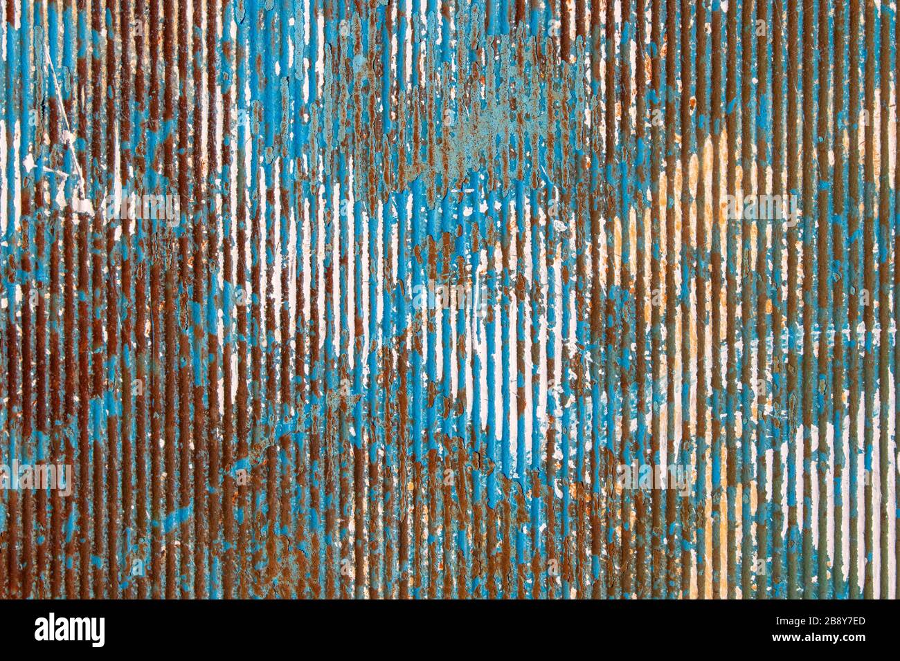 Peeling paint on rusty corrugated metal Stock Photo - Alamy