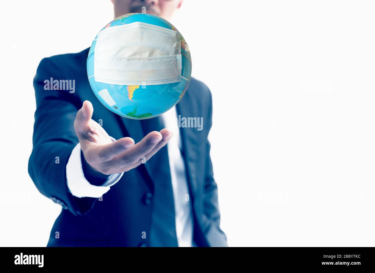 Human hand holding world globe with face mask Concept worldwide for ...