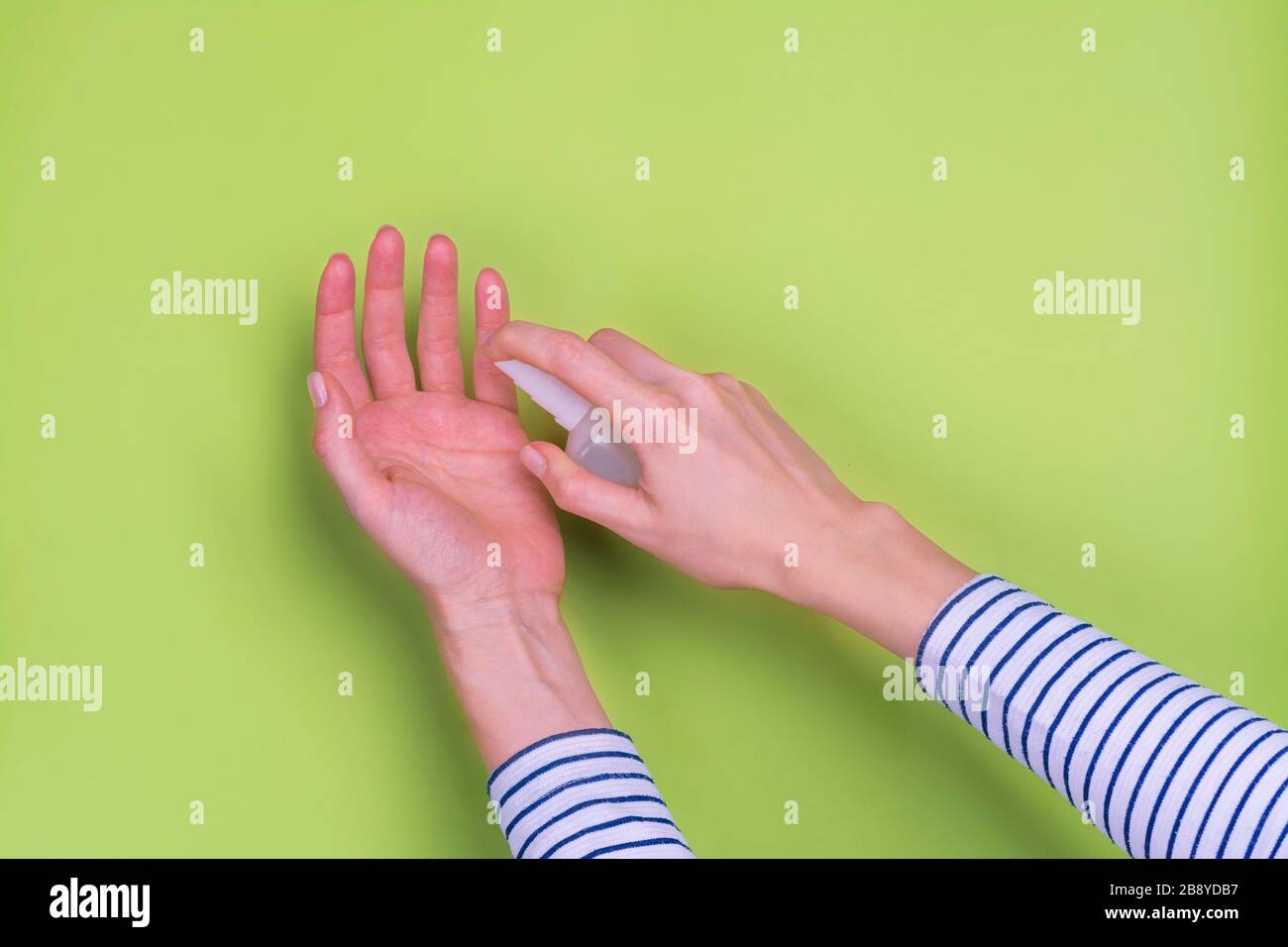 Using Hand Sanitizer Stock Photo Alamy