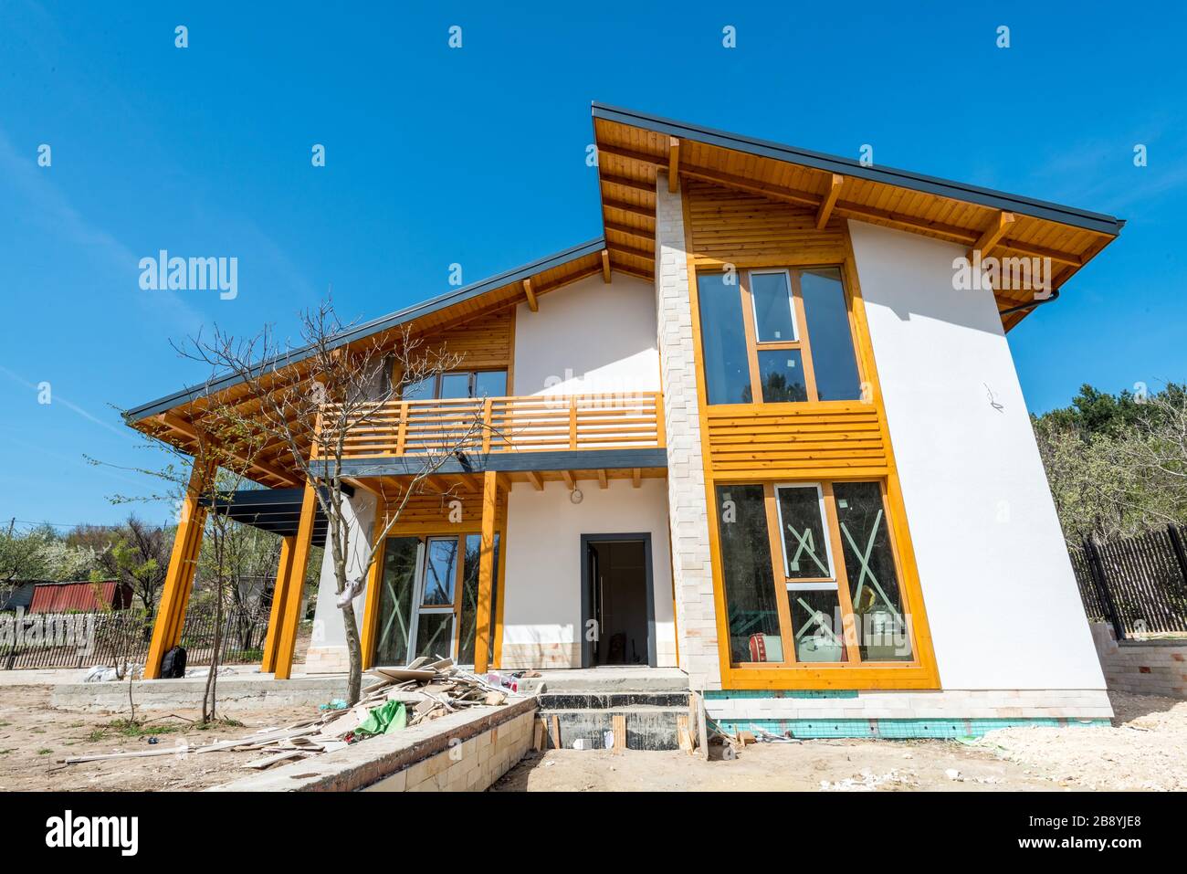 Wooden house under construction Stock Photo - Alamy