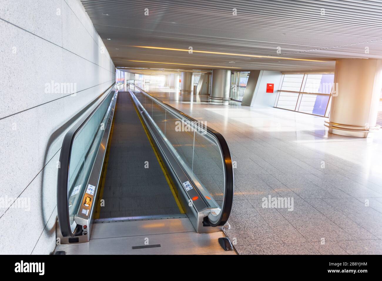 An empty travelator in the terminal of the airport for an accelerated ...