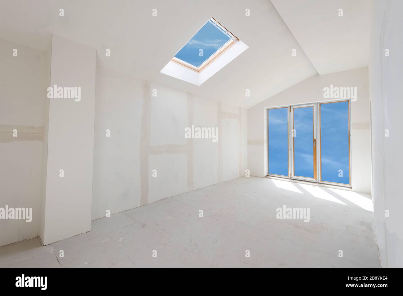 Unfinished building interior, white room with sky view (includes ...