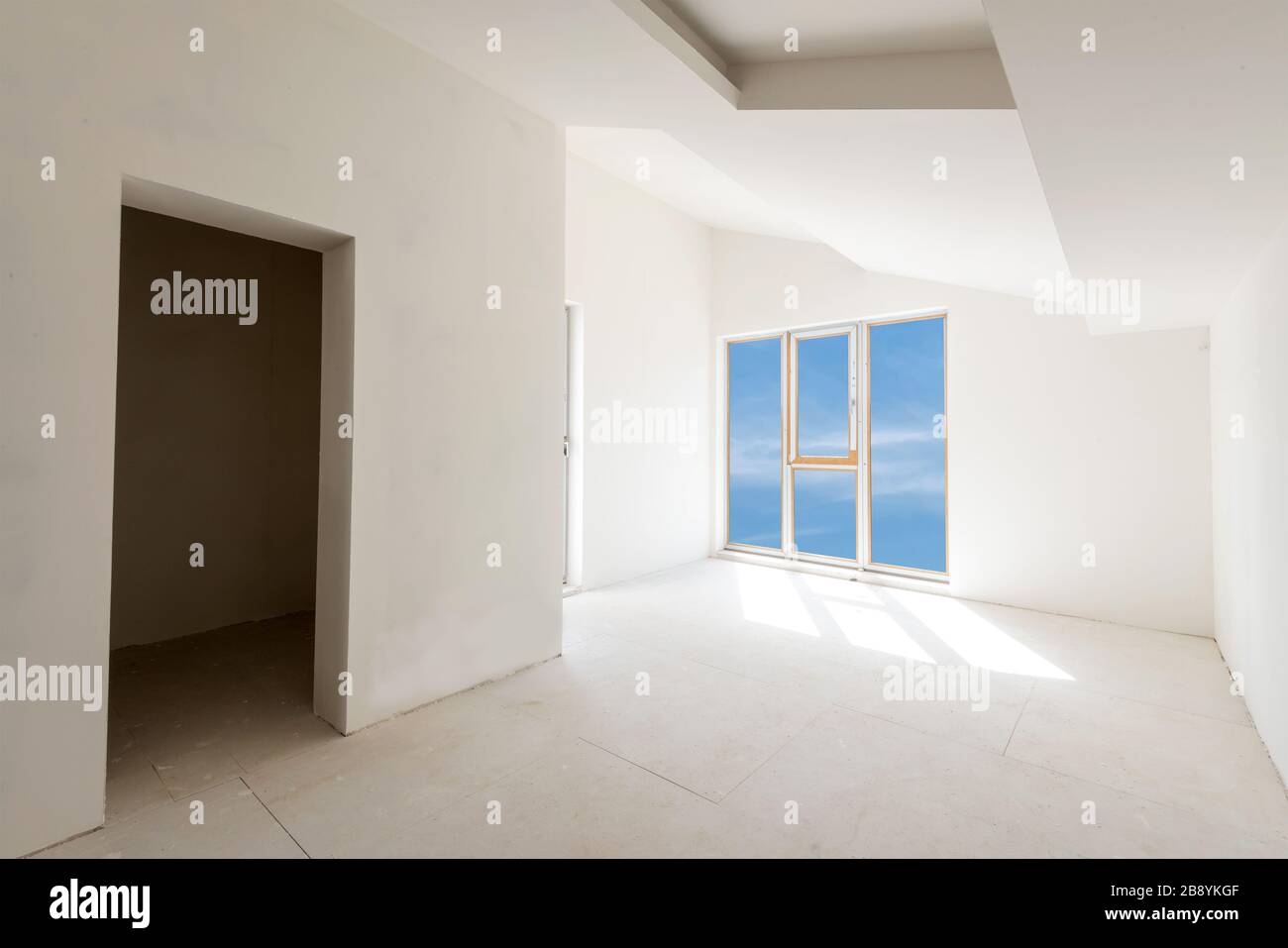 Unfinished building interior, white room with sky view (includes ...