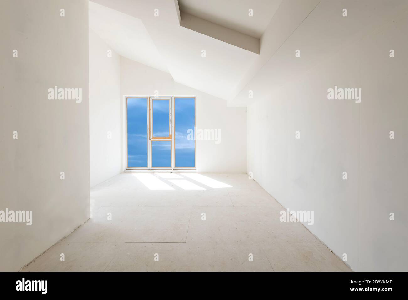Unfinished building interior, white room with sky view (includes ...