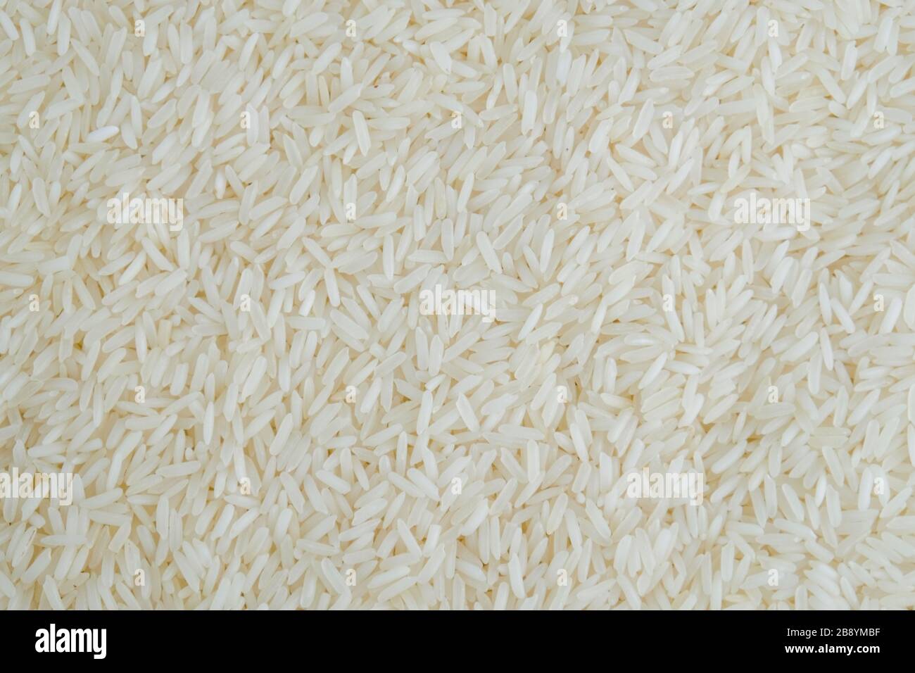 White long rice background texture Stock Photo - Alamy