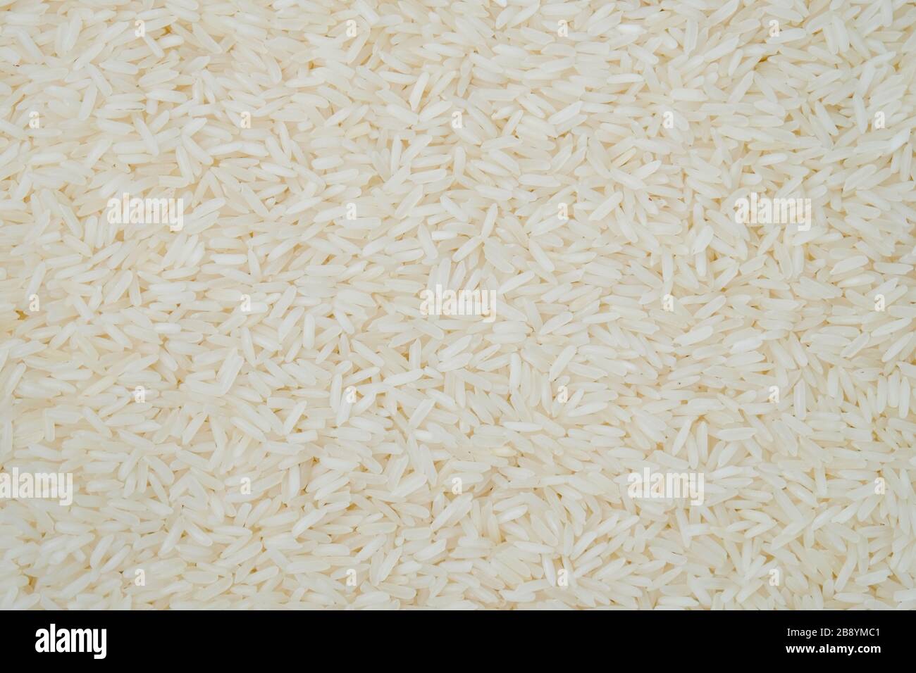 White long rice background texture Stock Photo - Alamy