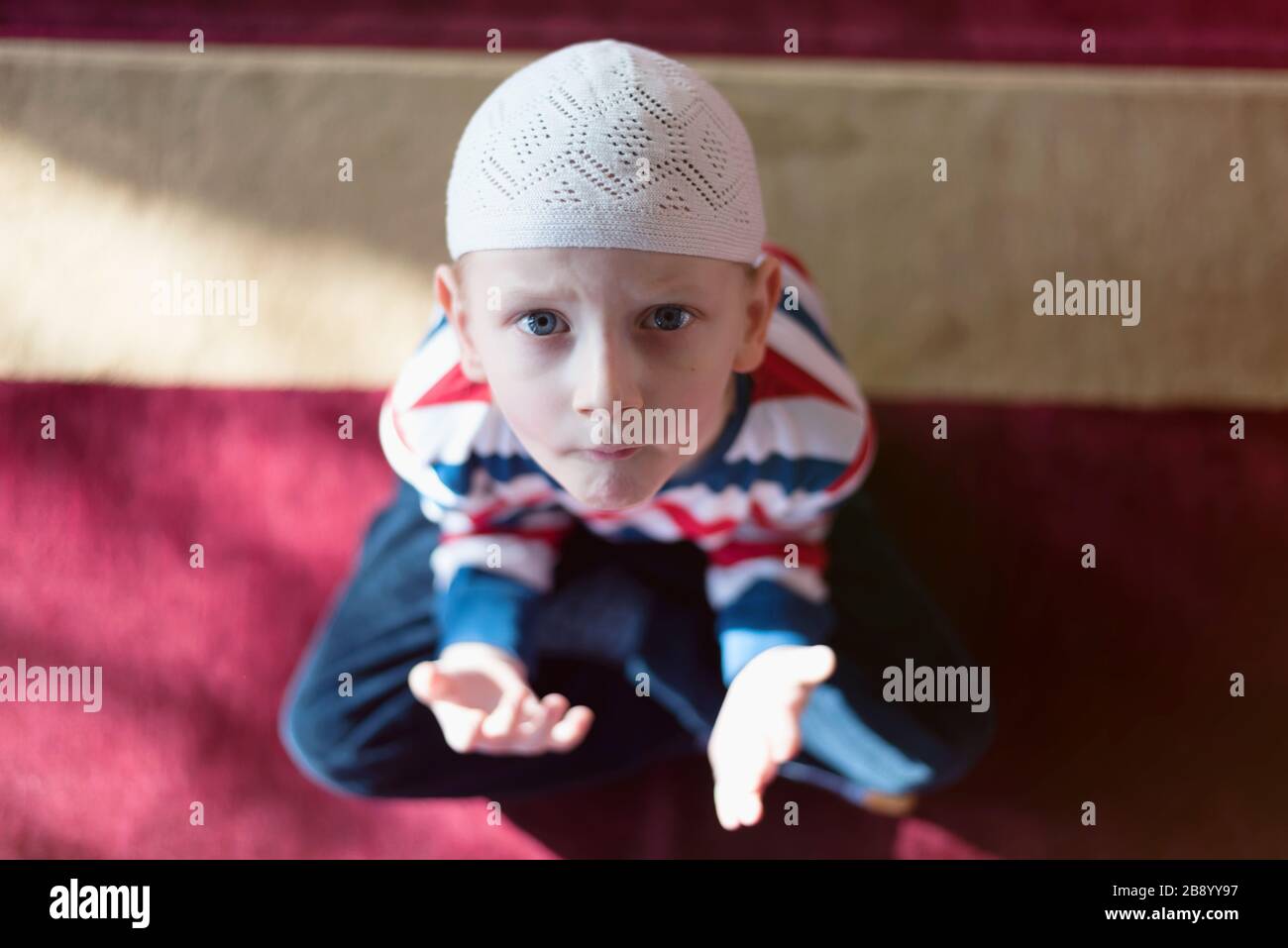 Ramadan Kareem,beautiful boy Muslim is praying in mosque,Peace and love ...