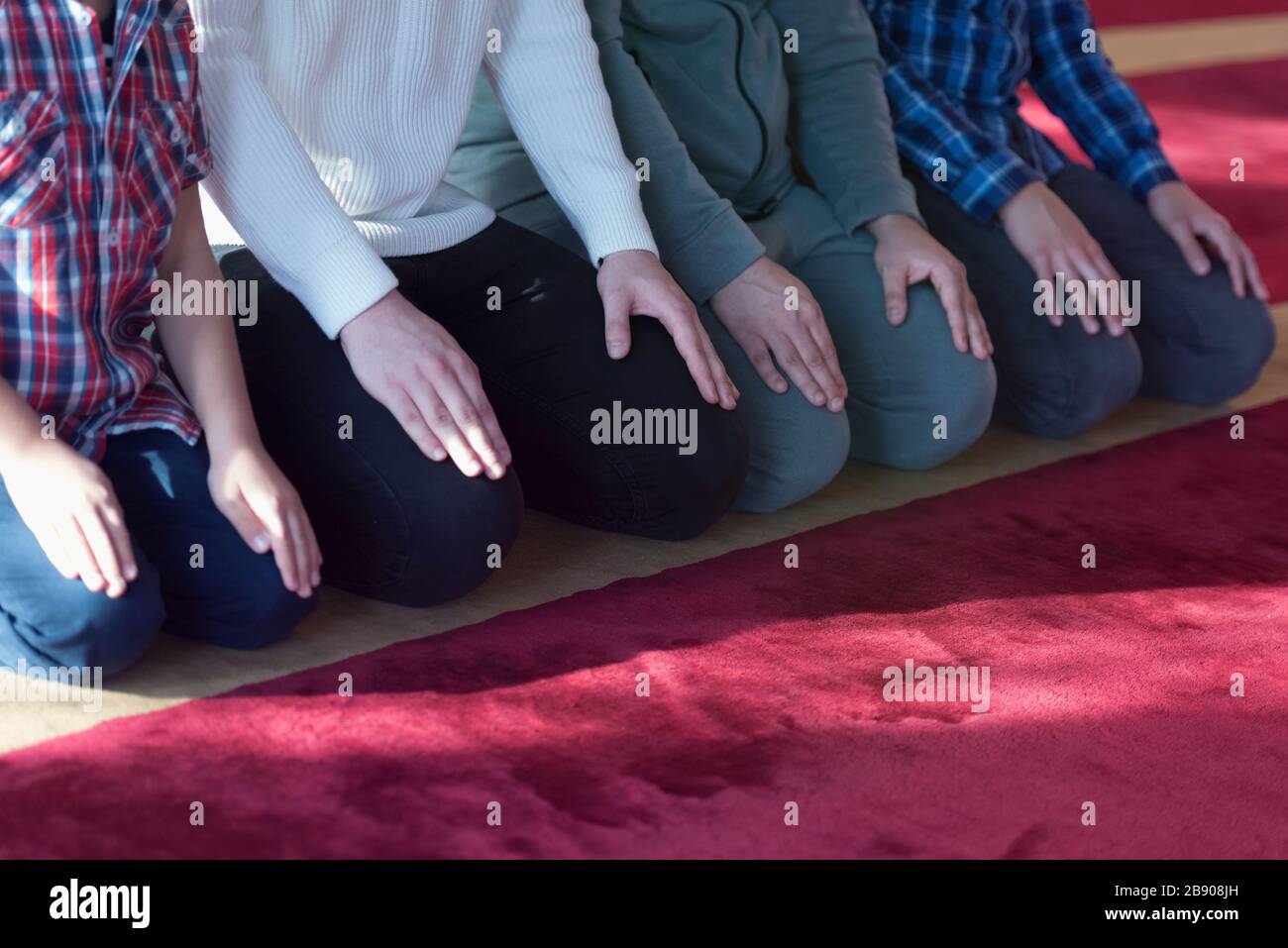 Group of young Muslim people praying. Muslim prayers doing a pray ...