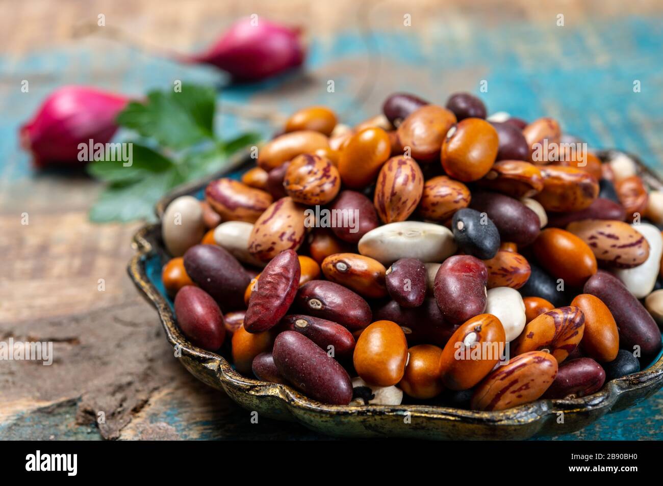 Colorful dried different types of beans legumes in bowl close up Stock ...