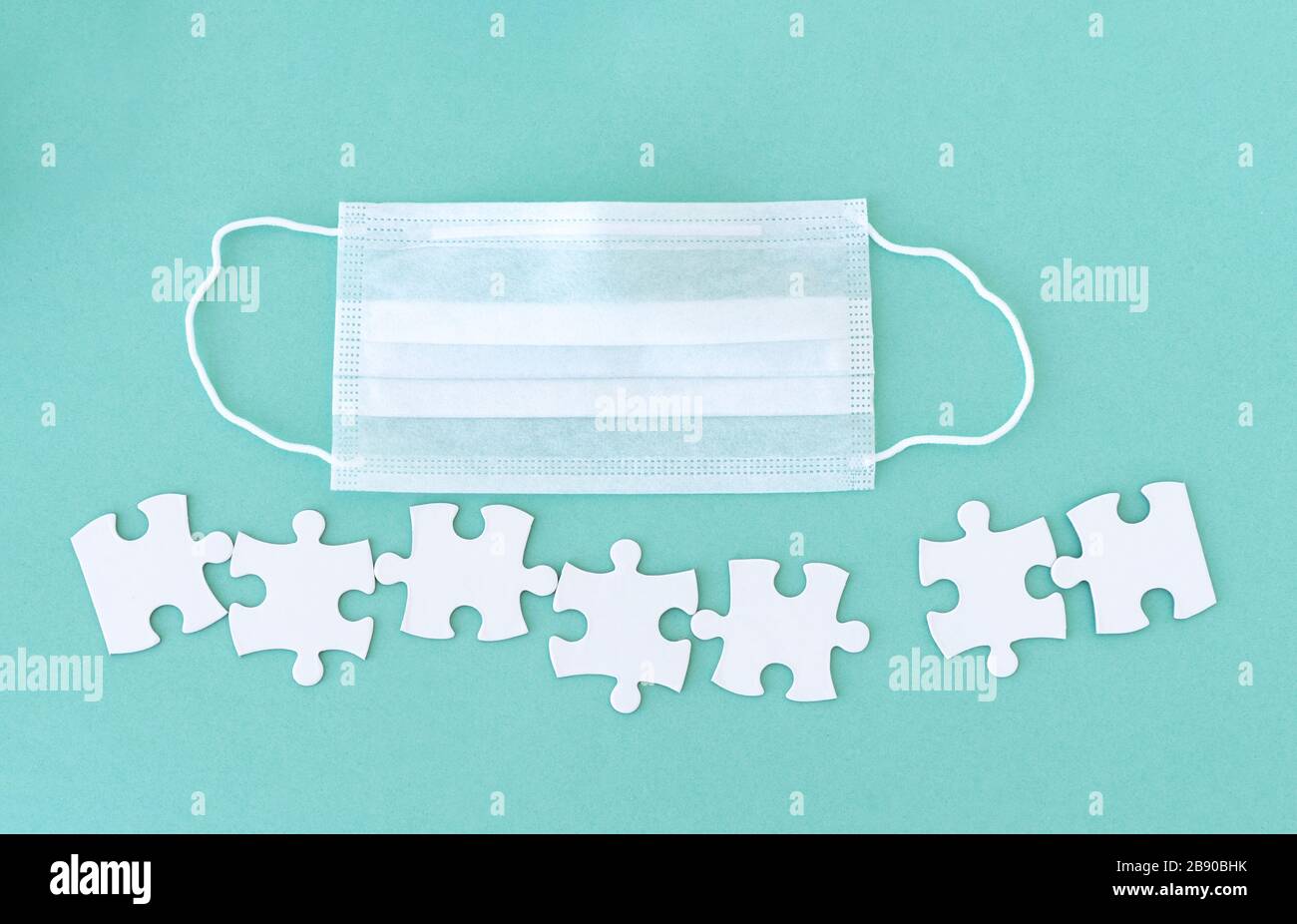 Medical mask and puzzle pieces Stock Photo - Alamy