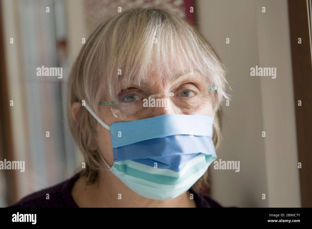 Mature woman wears self-made mask to protect herself from Covid-19 ...