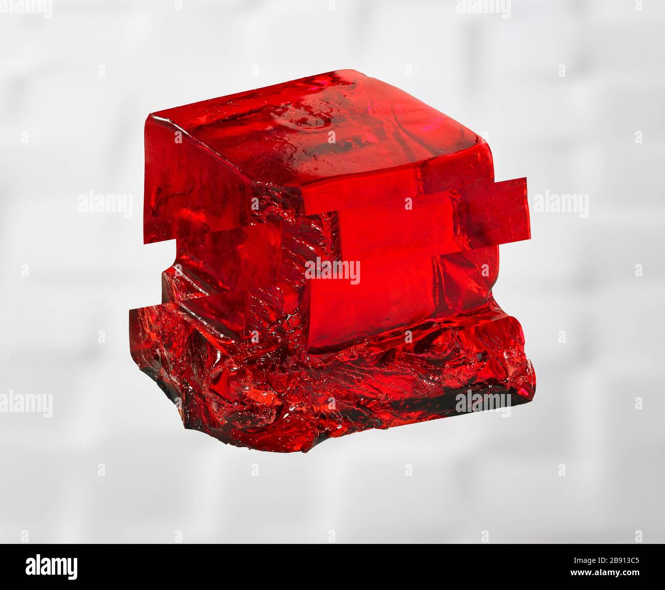 Cube of strawberry jelly Stock Photo - Alamy