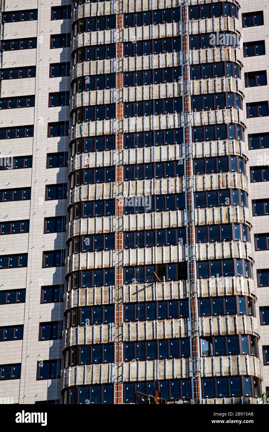 Unfinished high-rise apartment building. Close-up. City real estate ...