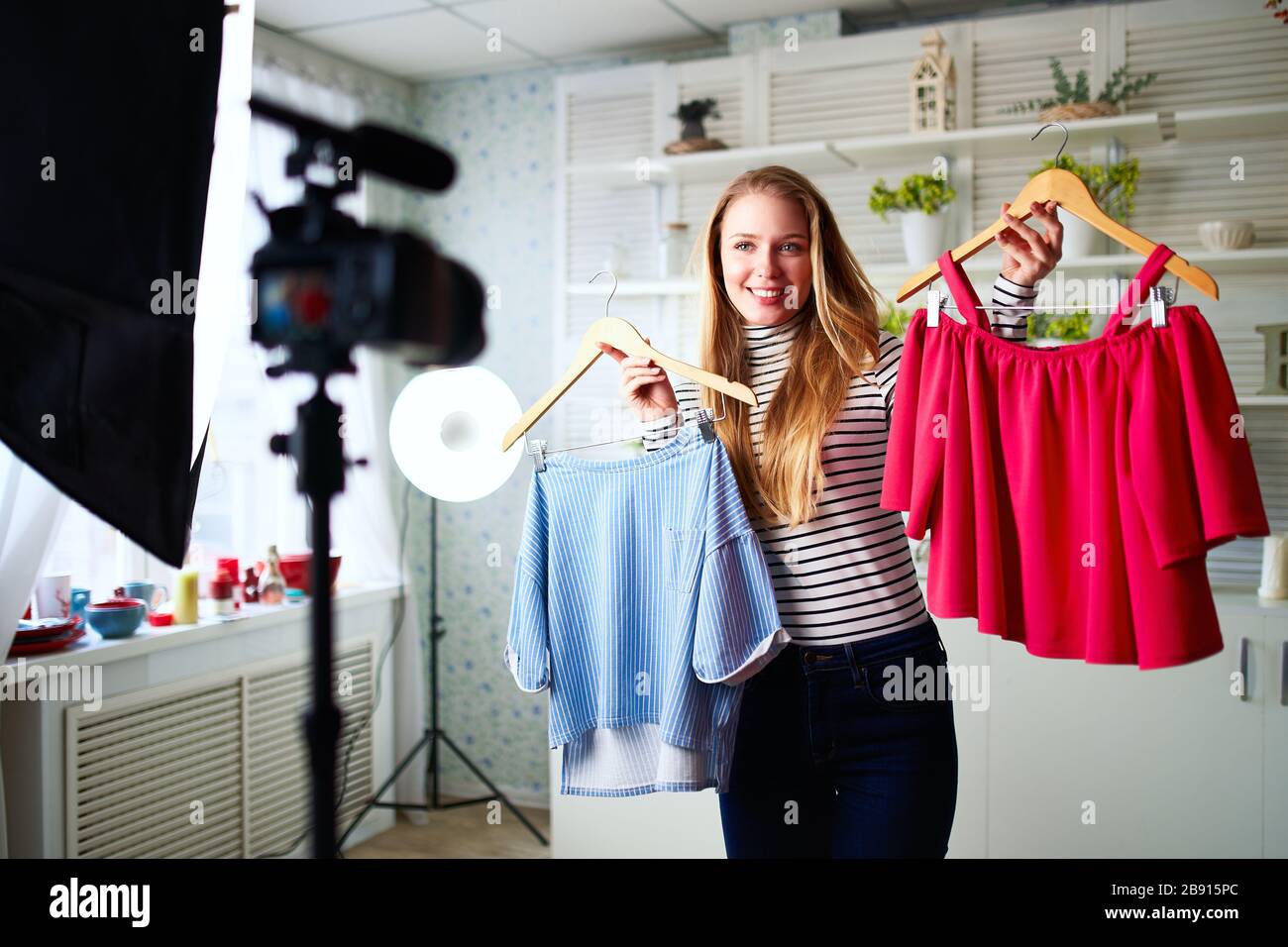 Fashion blogger woman in jeans and turtleneck showing casual colorful ...
