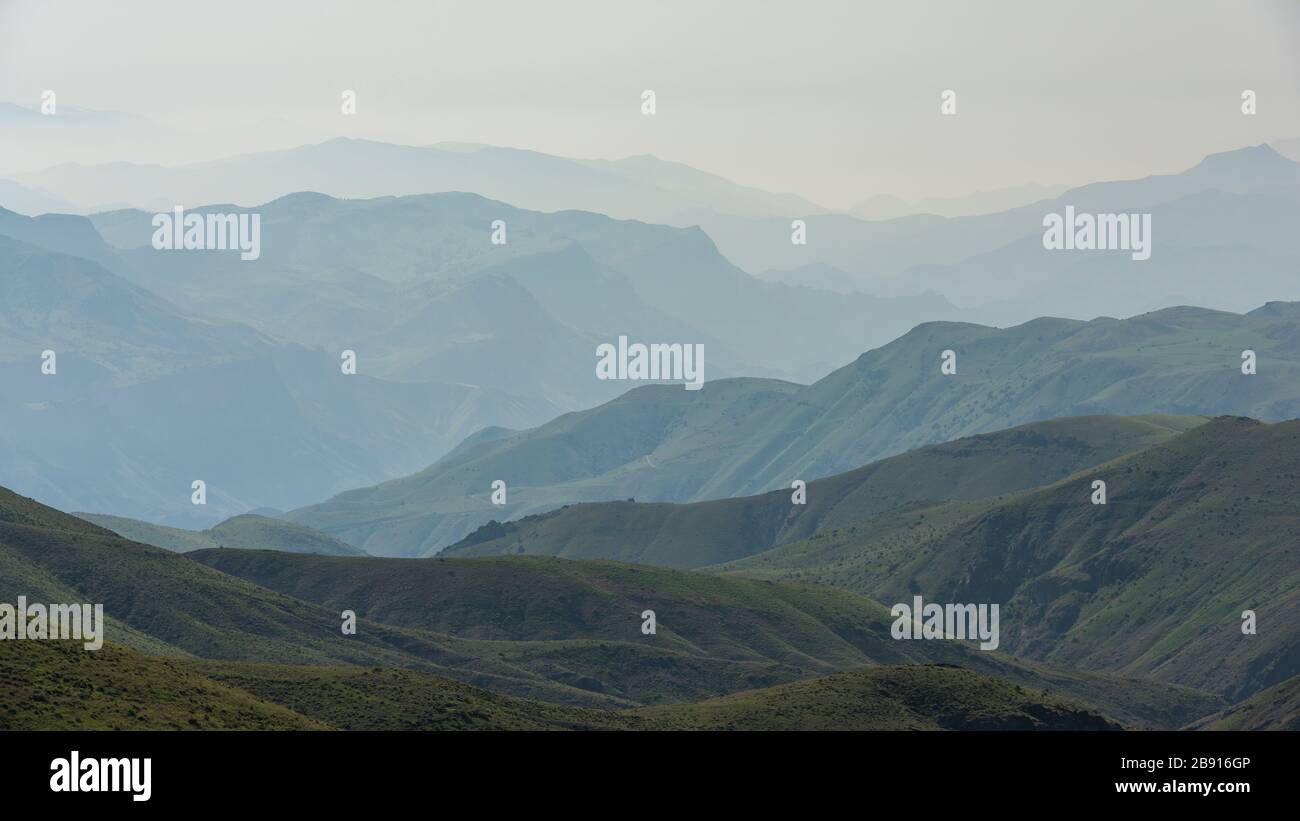 Green hills and mountains in Iran with foggy weather Stock Photo - Alamy