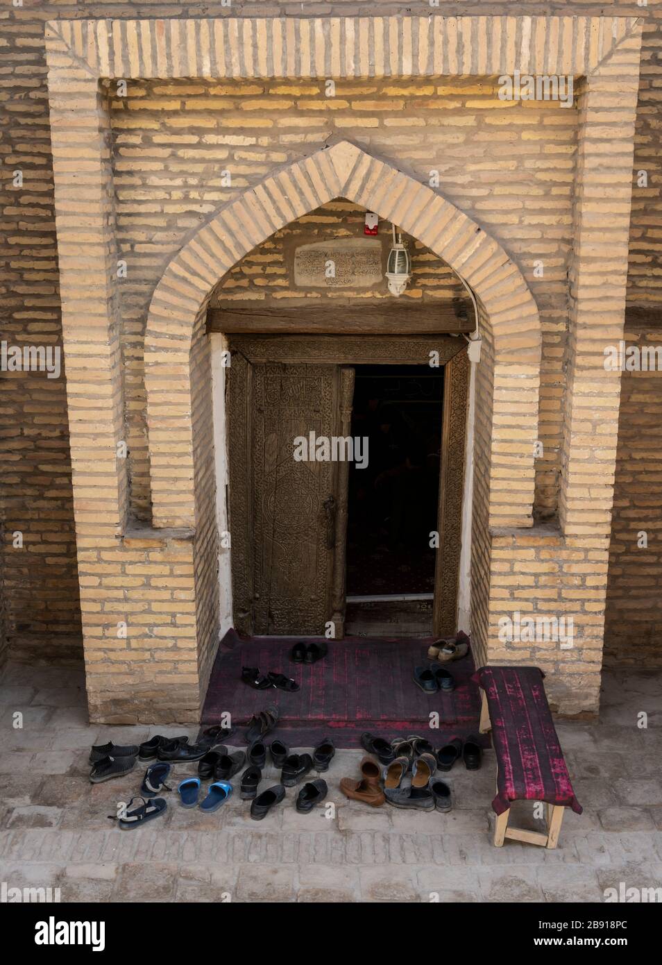 Shoes at the door of a mosque in Kviva in Uzbekistan Stock Photo - Alamy
