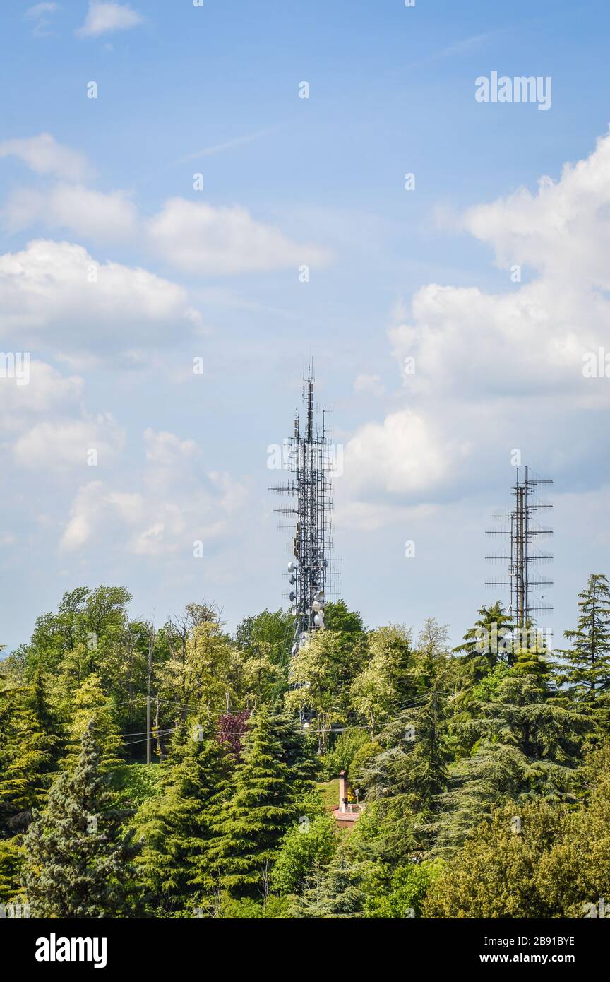Telecommunication tower with TV antennas and satellite dish ...
