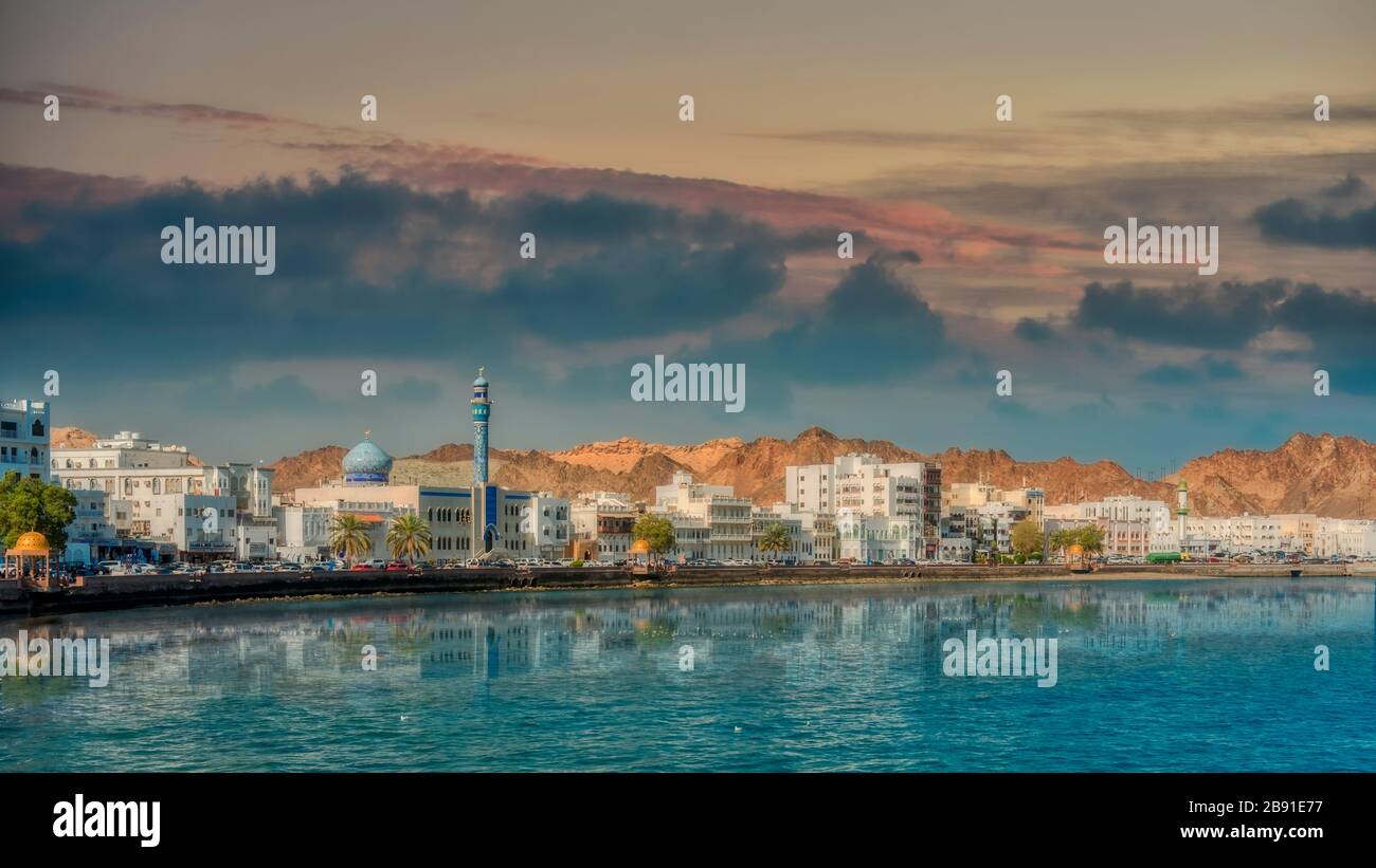 The waterfront of the capital city of Muscat, Oman, UAE reflected in ...