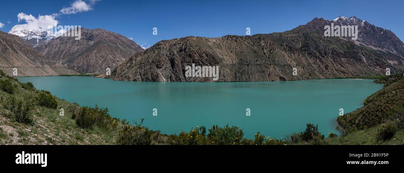 Panorama of the blue green Iskanderkul lake in Tazjikistan with high ...