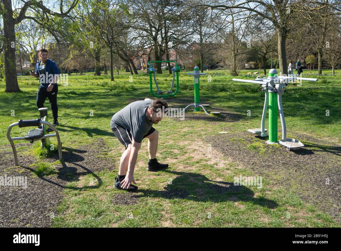 London, UK. Monday, 23 March, 2020. People exercising in an Ealing park ...