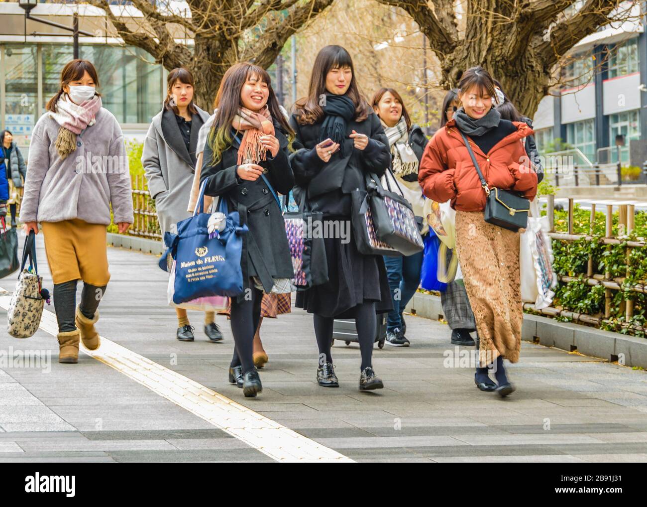 TOKYO, JAPAN, JANUARY - 2019 - Group of japanese girls walking at ...