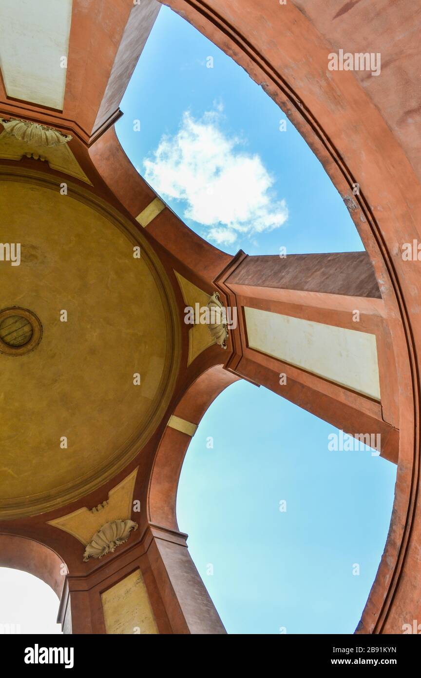 Bottom view of arcades of Sanctuary of Madonna di San Luca on blue sky ...