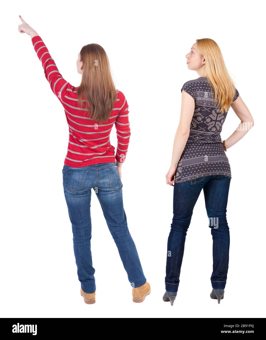 Back view of two pointing girl in sweater. Rear view people collection ...