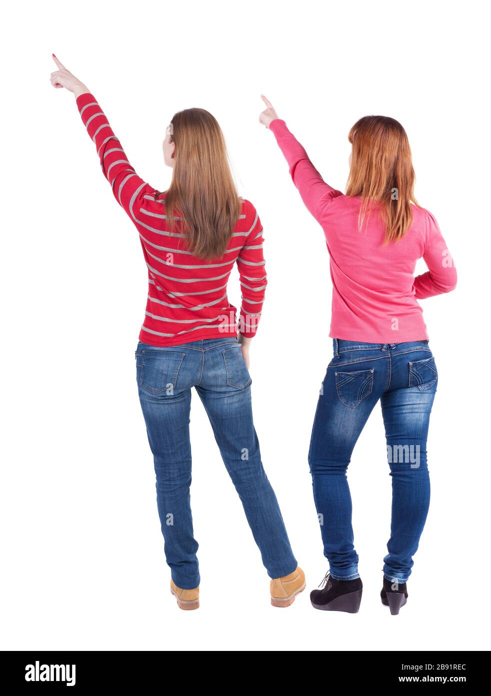 Back view of two pointing girl in sweater. Rear view people collection ...