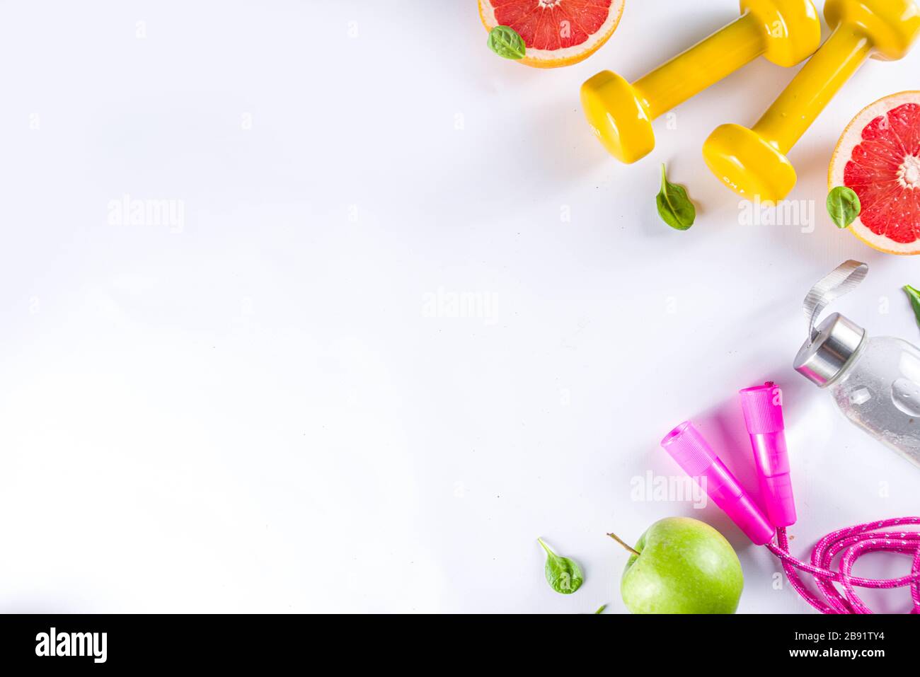 Fitness and healthy food lifestyle concept. Dumbbells, diet fruit and ...