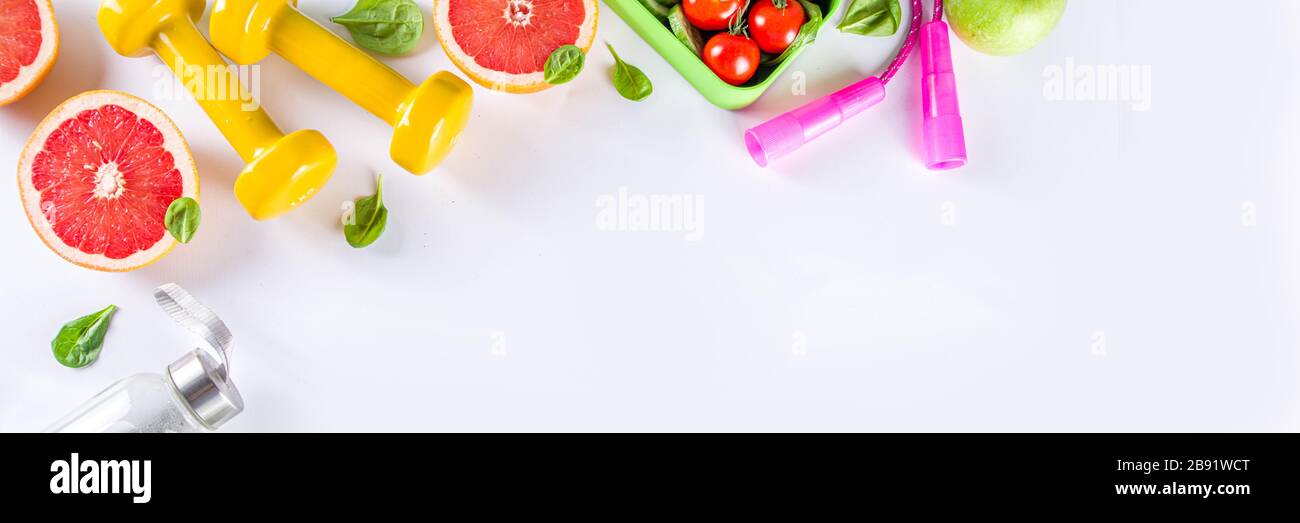Fitness and healthy food lifestyle concept. Dumbbells, diet fruit and ...