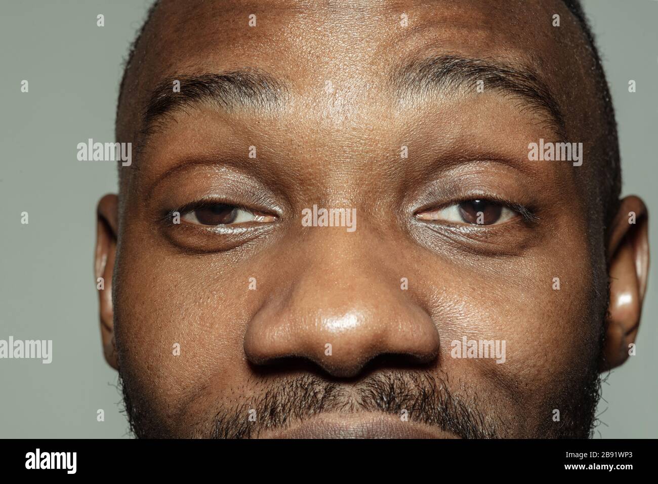 Delighted. Close up of face of beautiful african-american young man ...