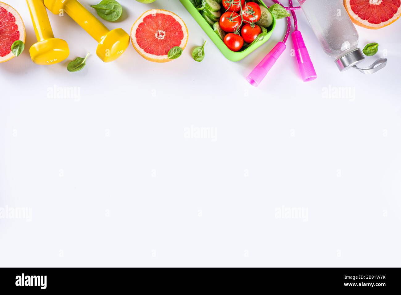 Fitness and healthy food lifestyle concept. Dumbbells, diet fruit and ...