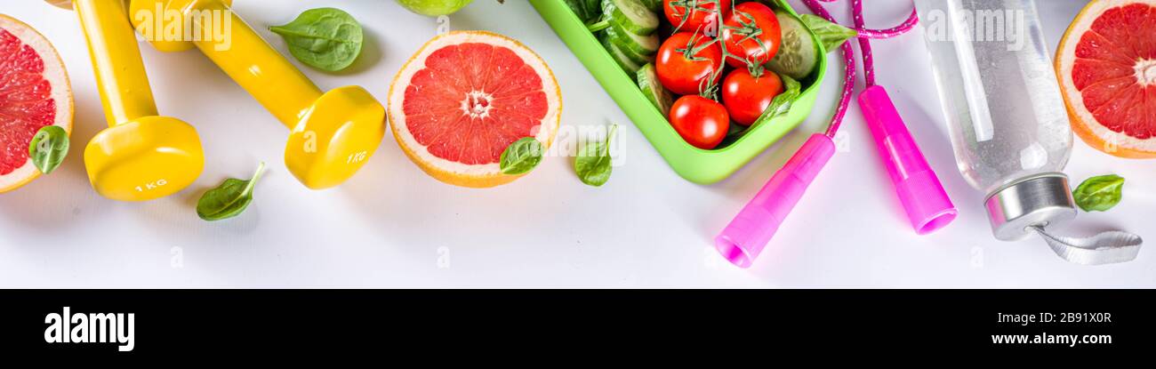 Fitness and healthy food lifestyle concept. Dumbbells, diet fruit and ...